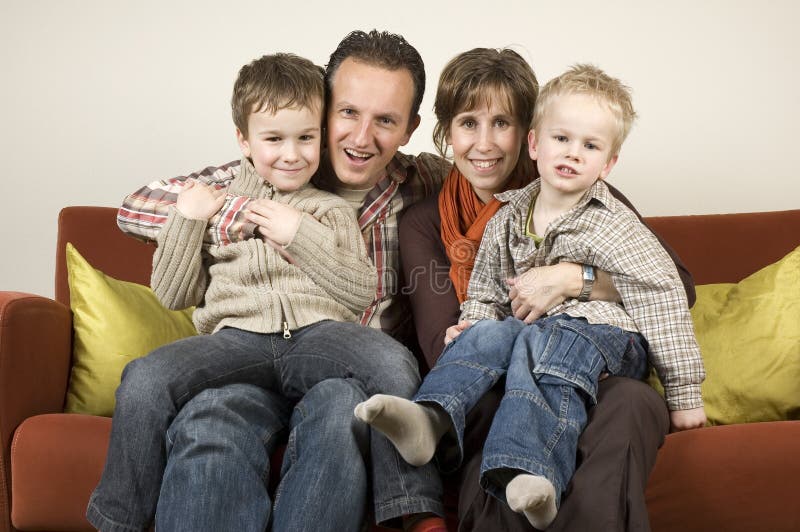 Family on a Couch 2 stock photo. Image of comfort, kids - 4173958