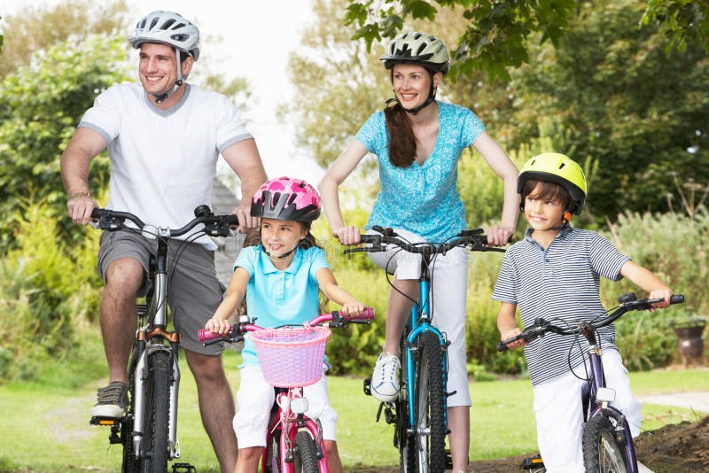 Family riding bicycles stock image. Image of children - 12224421