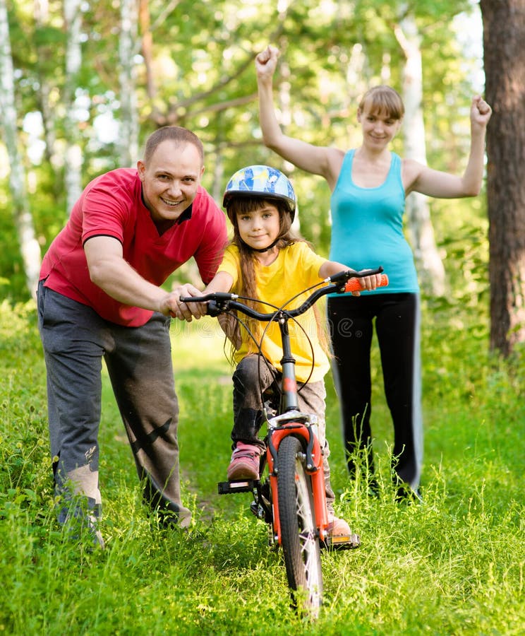 Family on Cycle Ride in Forest Stock Photo - Image of bicycle, helmet ...