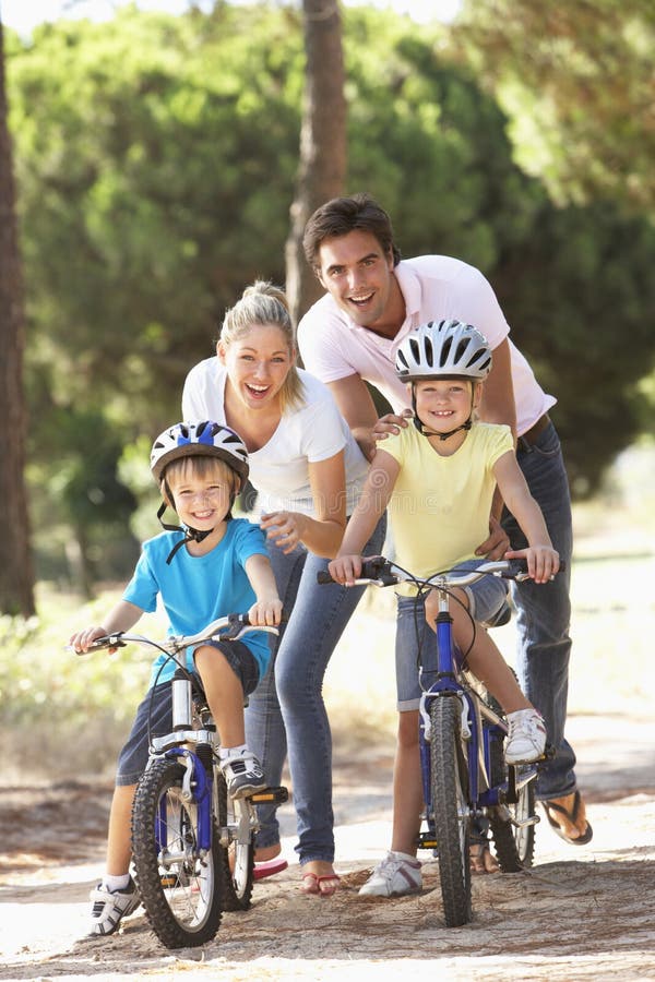 Family on Cycle Ride Together Stock Image - Image of portrait, learning ...