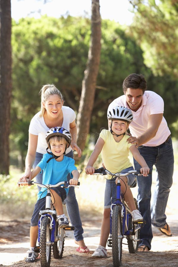 Family on Cycle Ride Together Stock Image - Image of father, park: 54940895
