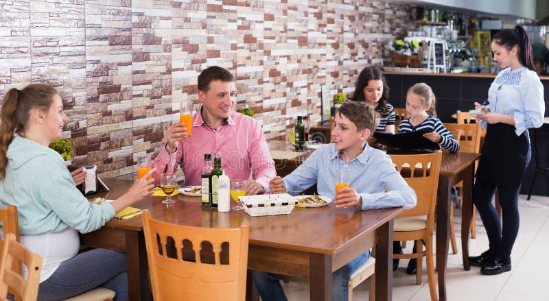 Family dining and talking stock image. Image of chatting - 92414593