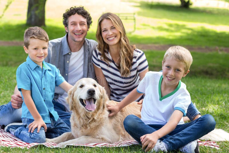 Family with Dog in the Park Stock Image - Image of parkland, park: 67760365