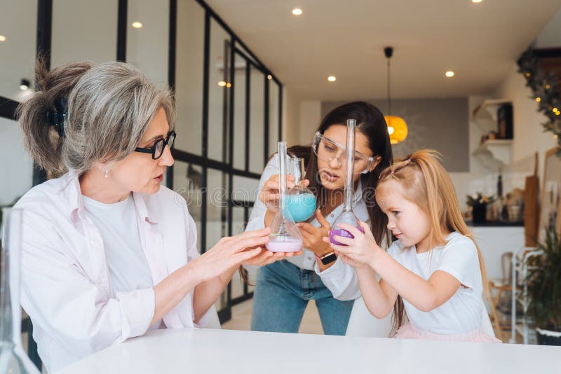Family Doing Chemical Experiment, Mixing Flasks Indoors Stock Image ...