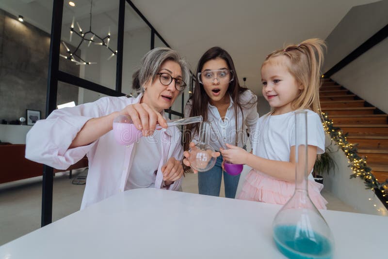 Family Doing Chemical Experiment, Mixing Flasks Indoors Stock Image ...