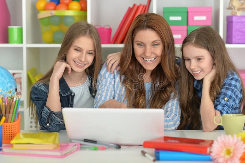 Family Doing Homework Together Stock Photo - Image of caucasian, parent ...