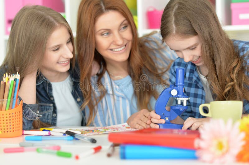 Family Doing Homework Together Stock Photo - Image of friends, mother ...