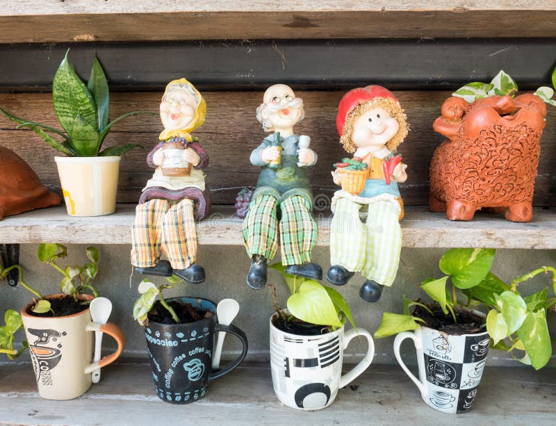 Family Dolls and Tree Pot on Shelf Stock Image - Image of material ...