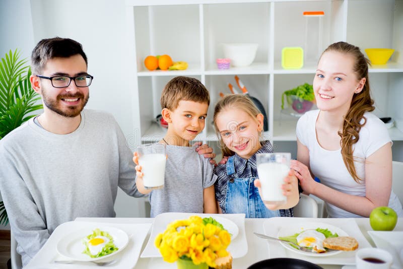 Family Drinks Milk for Breakfast Stock Photo - Image of eating ...