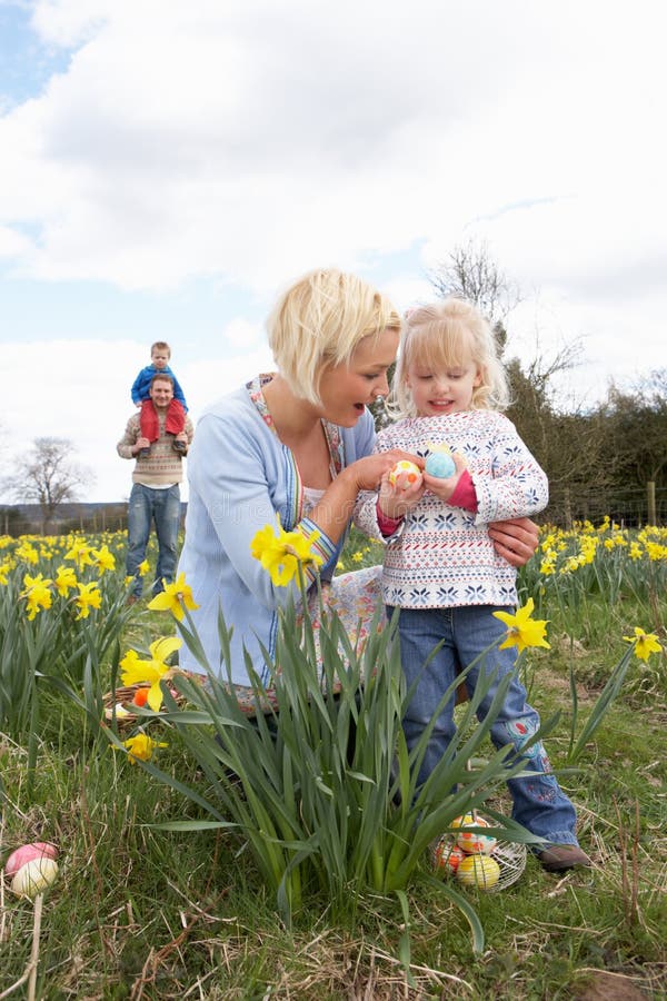 Family on Easter Egg Hunt in Daffodil Field Stock Photo - Image of ...