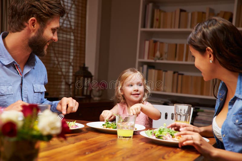 Family Eating Dinner at a Dining Table Stock Photo - Image of drink ...