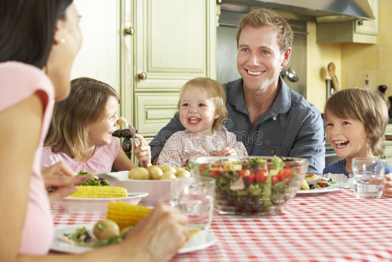 Family Eating Meal Together in Kitchen Stock Image - Image of girl ...