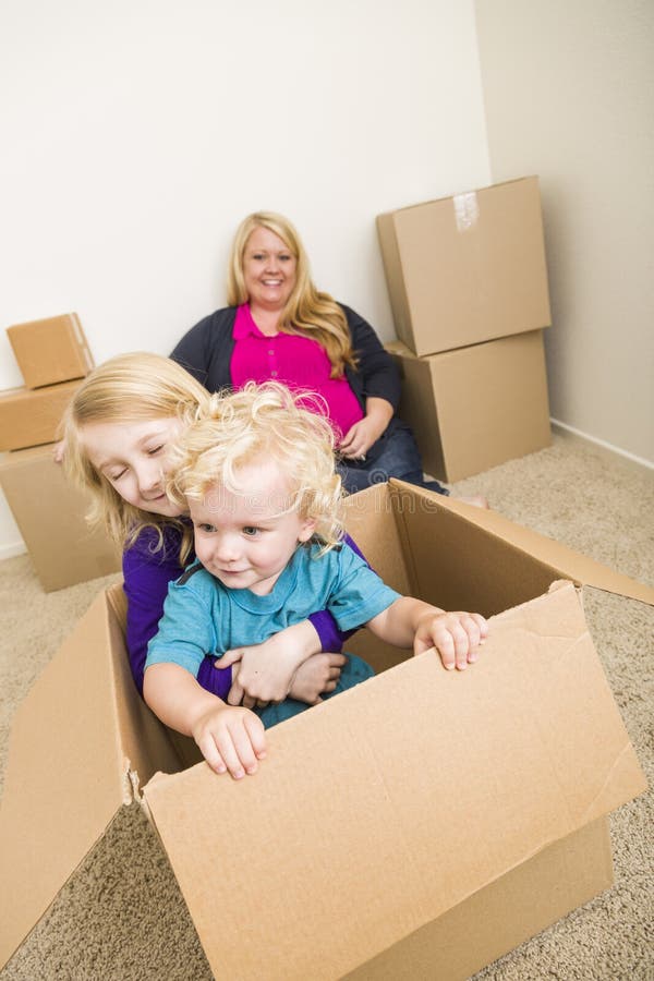 Family in Empty Room Playing with Moving Boxes Stock Image - Image of ...