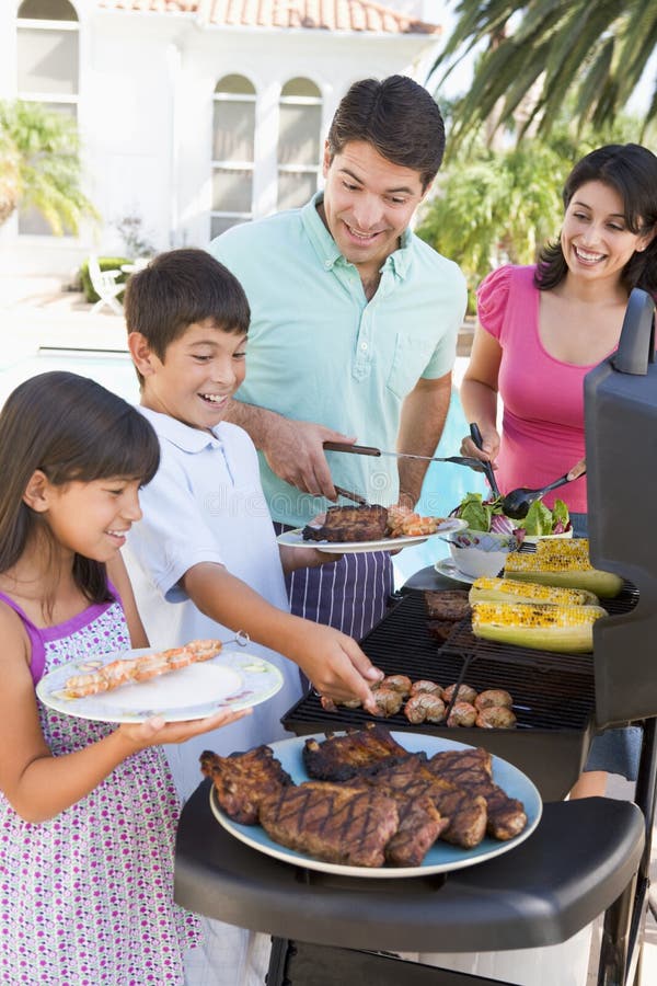Family Enjoying a Barbeque stock photo. Image of colour - 7230586