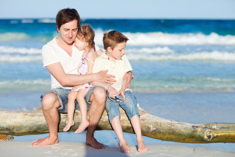 Family Enjoying Evening by the Sea Stock Photo - Image of outdoor ...