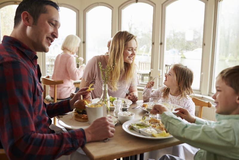 Family Enjoying Meal in Restaurant Together Stock Photo - Image of meal ...