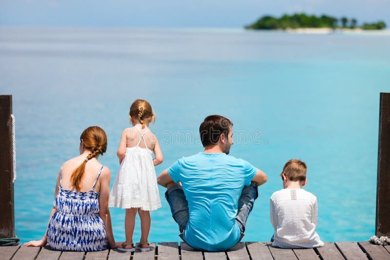 Family enjoying ocean view stock image. Image of four - 24343751