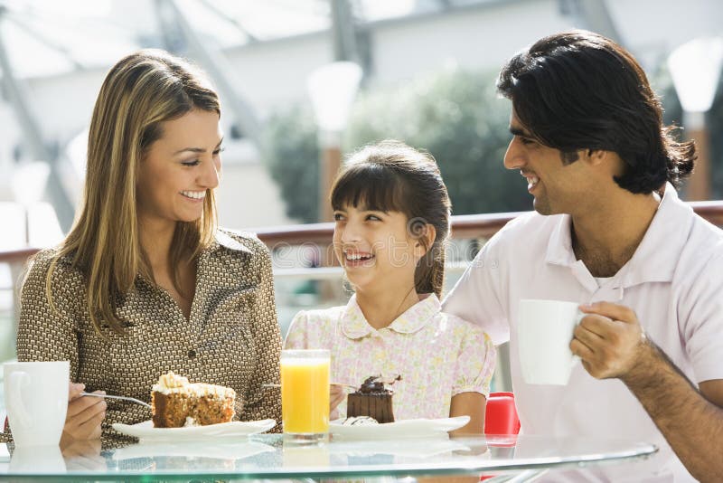 Family Enjoying Snack at Cafe Stock Photo - Image of drinking, happy ...
