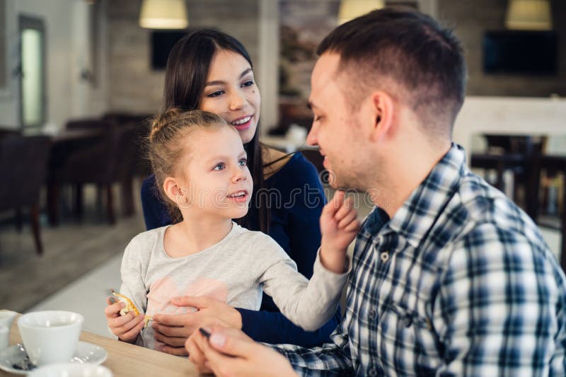Family Enjoying Tea in Cafe Together Stock Image - Image of mall ...