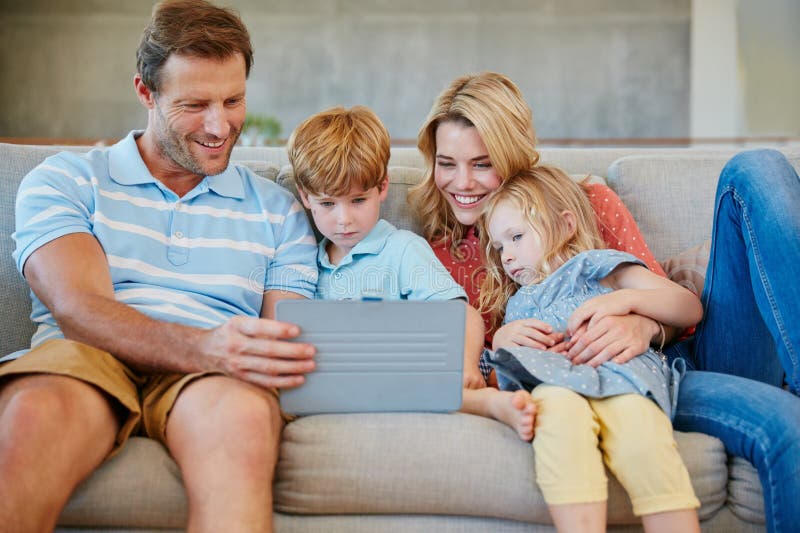 Family Entertainment Gone Digital. a Family Using a Digital Tablet ...