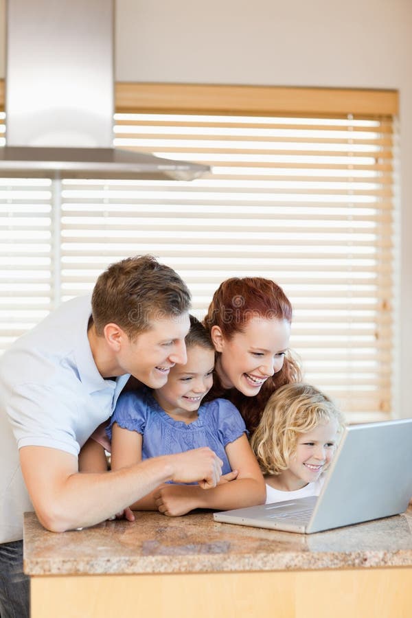 Family Exploring the Internet in the Kitchen Stock Image - Image of ...