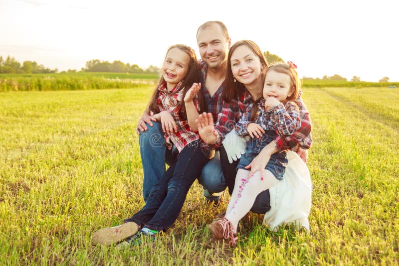 Family in the field. stock image. Image of laughing, nature - 55555595