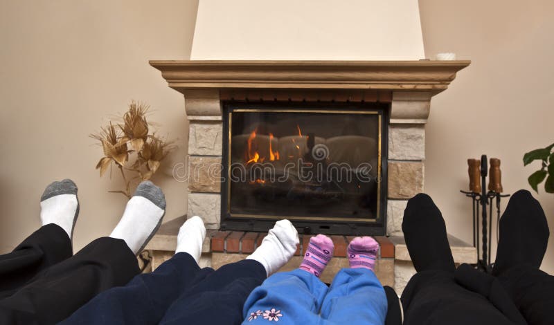 Family of Feet Warming at a Fireplace Stock Photo - Image of fireplace ...