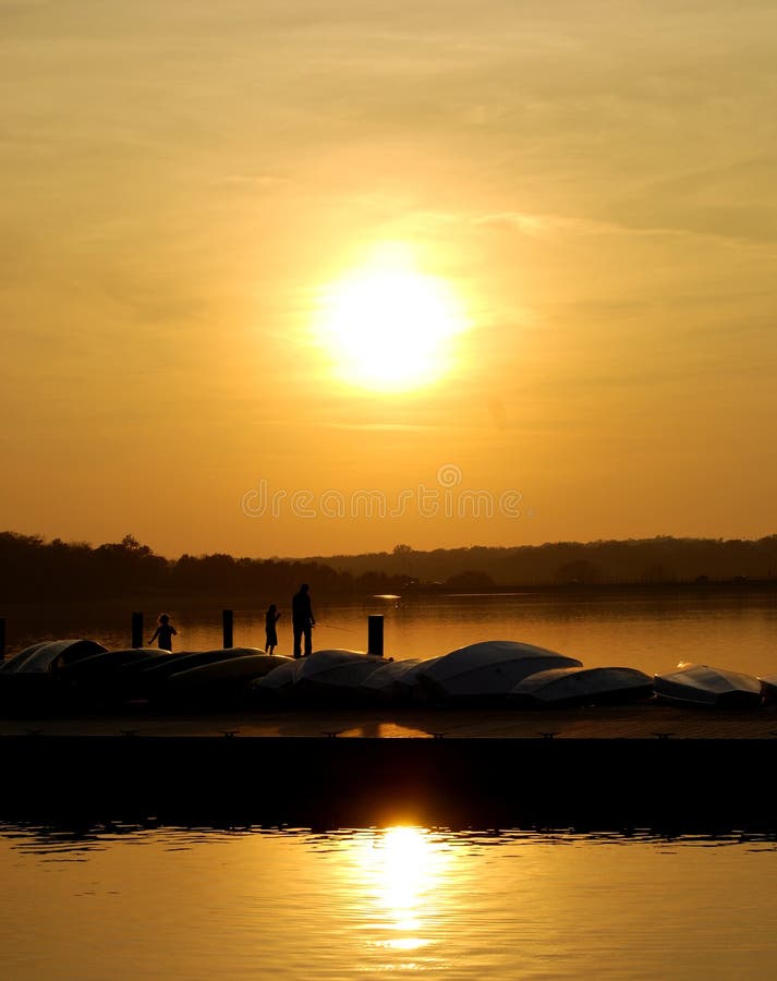 Family fishing with Sunset stock photo. Image of water - 7100964