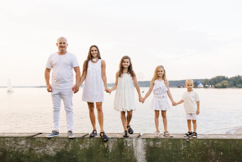 Happy Family of Five, Including Couple and Three Children are Posing ...