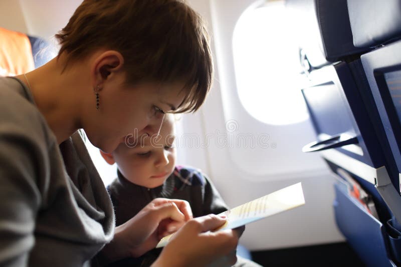 Family on the flight stock photo. Image of airplane, little - 39494494