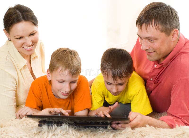 Happy Family Using Laptop on Sofa Stock Image - Image of happy, home ...