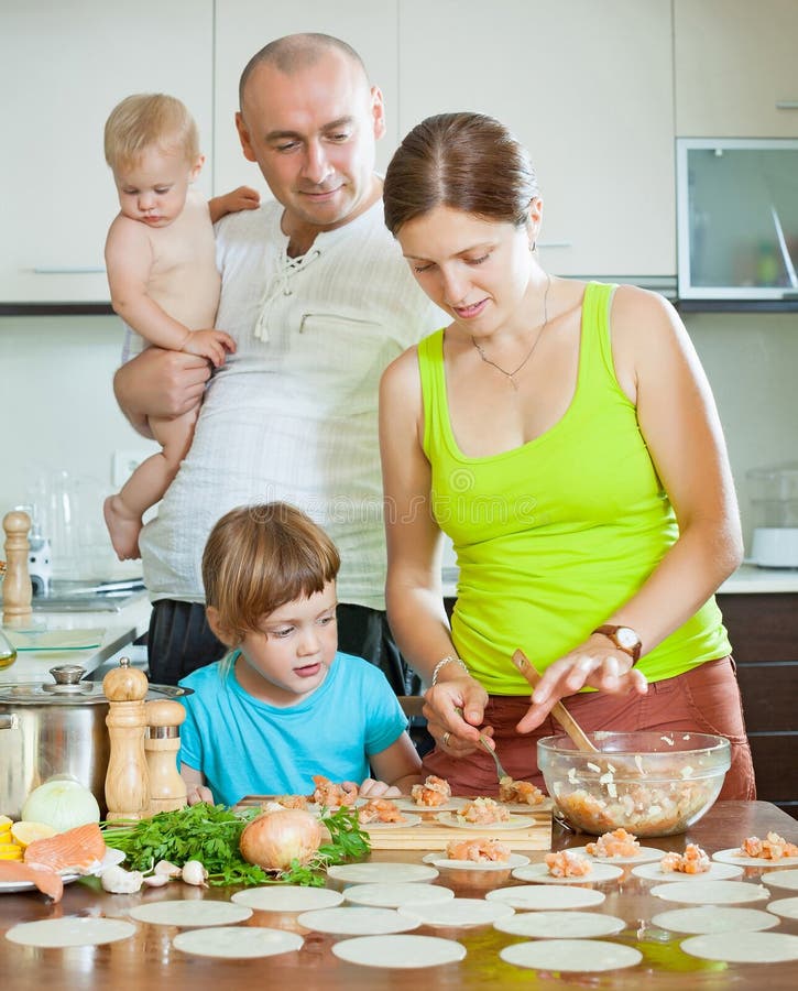 Family of Four Making Dumplings Stock Photo - Image of family, sibling ...