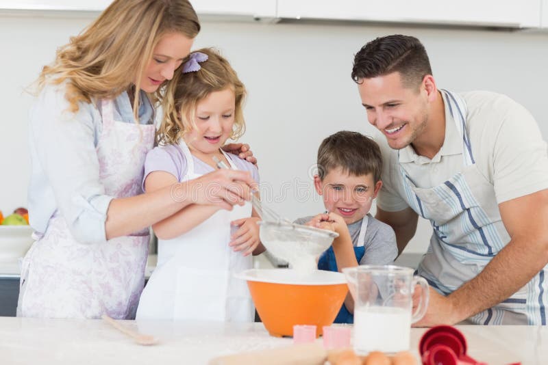 Family of Four Preparing Cookies Stock Image - Image of father, couple ...