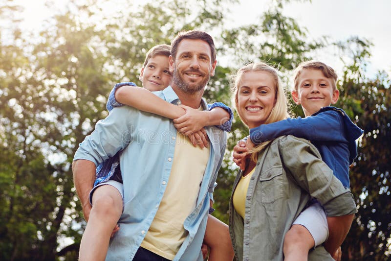 Family Fun in the Sun. a Family of Four Walking in the Woods. Stock ...