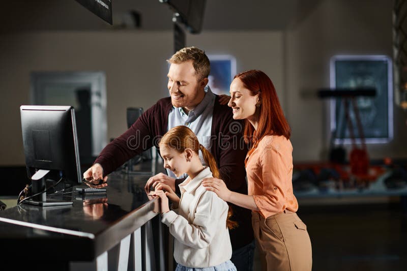 Family Gathered Around a Computer Screen Stock Image - Image of ...