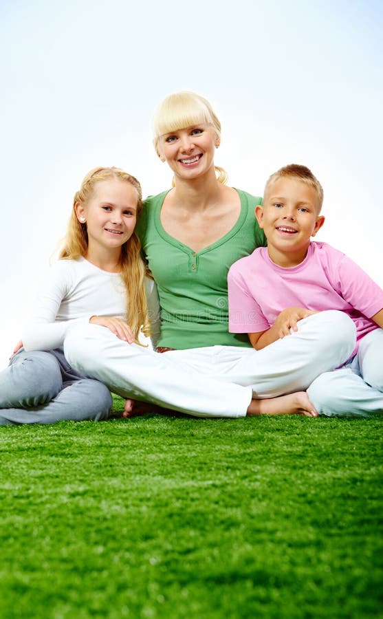 Family on grass stock photo. Image of female, blue, affectionate - 16127430