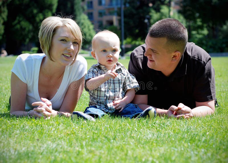 Family in Grass - Horizontal Stock Image - Image of caucasian, lawn ...