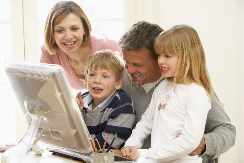 Family Group Using Computer Together Stock Photo - Image of sister ...
