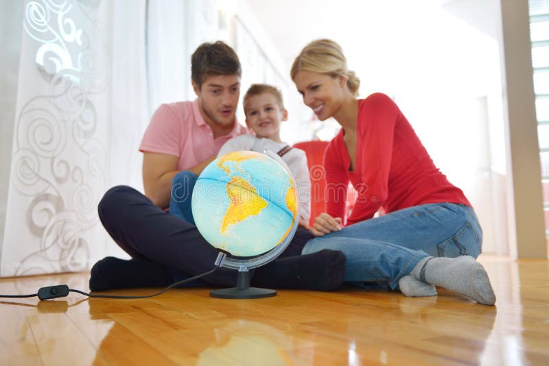 Family have fun with globe stock image. Image of blond - 36839701