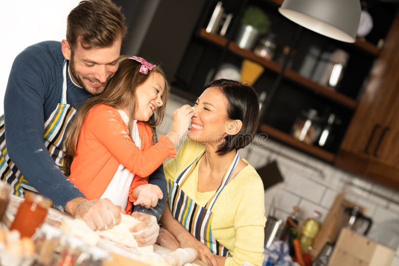 Family have fun in kitchen stock image. Image of kitchen - 176787371