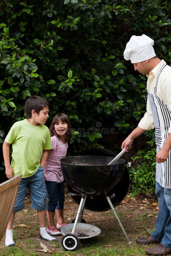 Family Having a Barbecue in the Garden Stock Photo - Image of cheerful ...