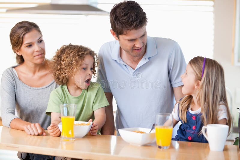Family having breakfast stock photo. Image of juice, breakfast - 22660712