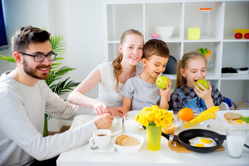 Family having breakfast stock photo. Image of mother - 93796988