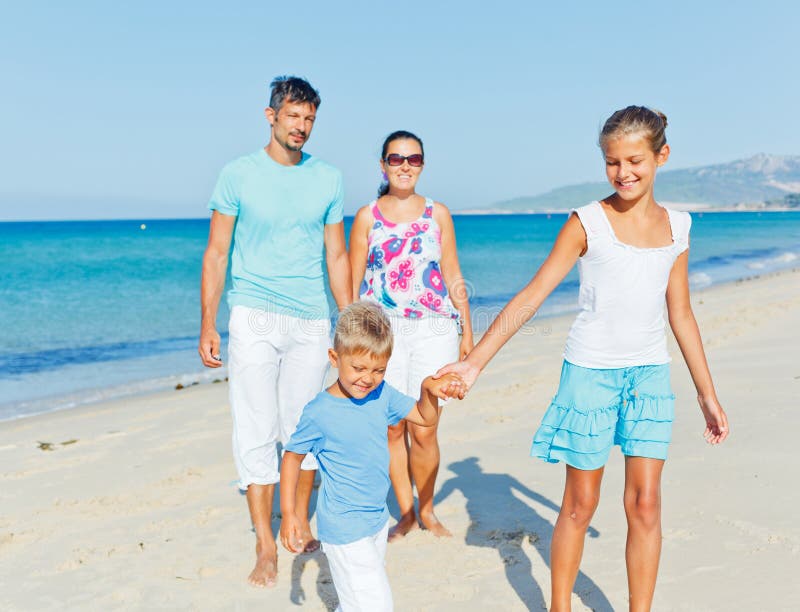 Family having fun on beach stock photo. Image of outside - 38309154