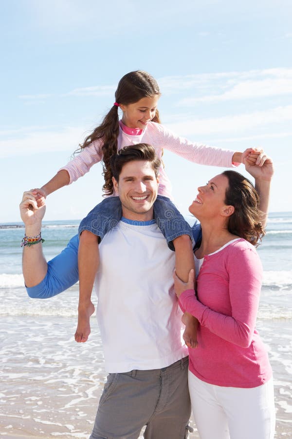 Family Having Fun on Beach Holiday Stock Photo - Image of children ...