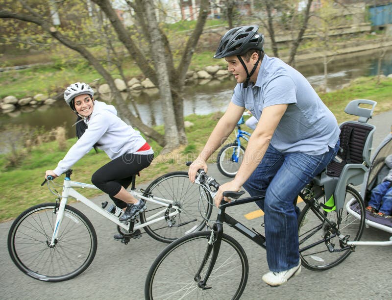 Family having fun on bikes stock photo. Image of exercise - 56066658