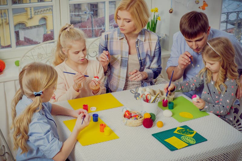 Family Having Fun Painting and Decorating Easter Eggs. Stock Image ...