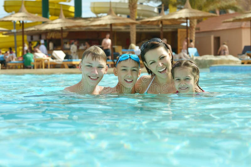 Family having fun in pool stock photo. Image of caucasian - 101809098