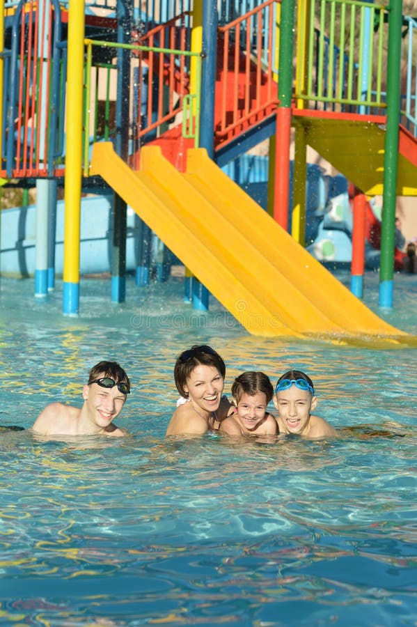 Family having fun in pool stock photo. Image of boys - 54238080