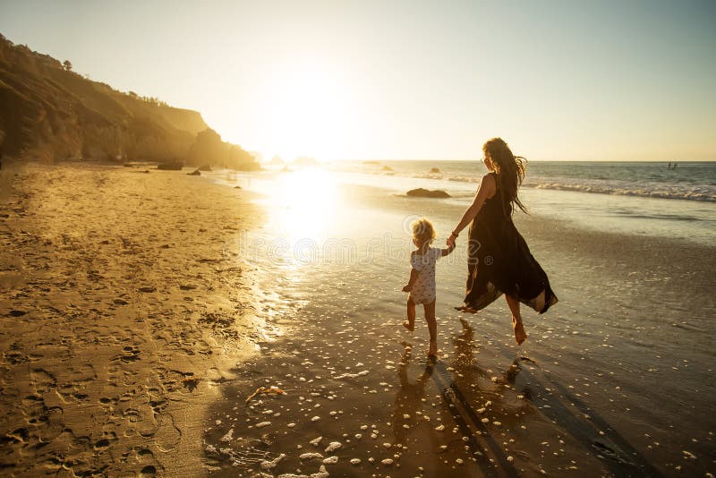 A Family is Having Fun at the Seashore Stock Photo - Image of smiling ...